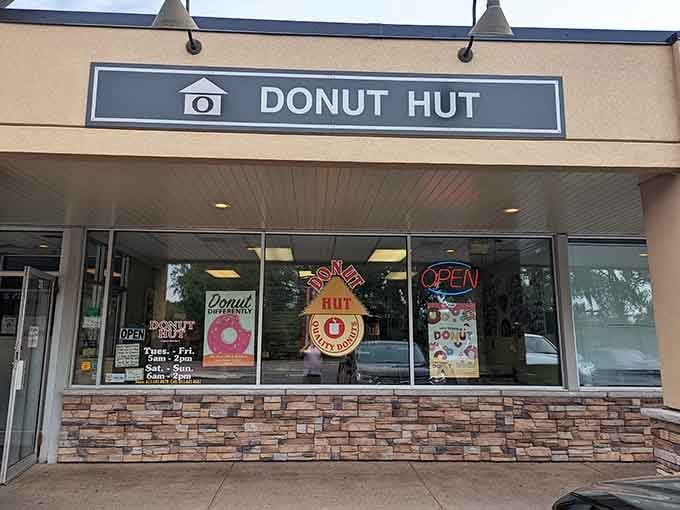 That cheerful storefront with its stone base and welcoming windows promises fresh-baked happiness waiting inside for you.