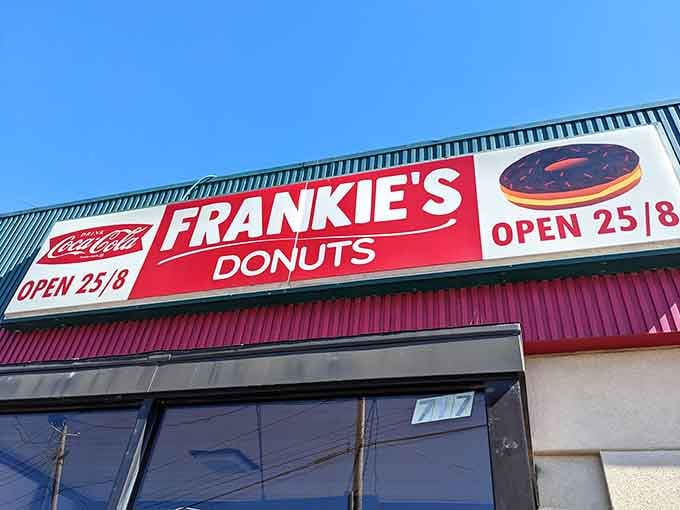 That giant chocolate-frosted donut on the sign isn't just decoration&mdash;it's a delicious promise being made.