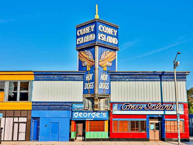 That towering blue sign practically shouts "hot dogs here!" louder than your grandkids asking for ice cream.