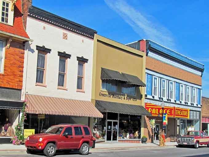 That Palace Theatre marquee shines like a beacon of small-town charm against these perfectly preserved storefronts.