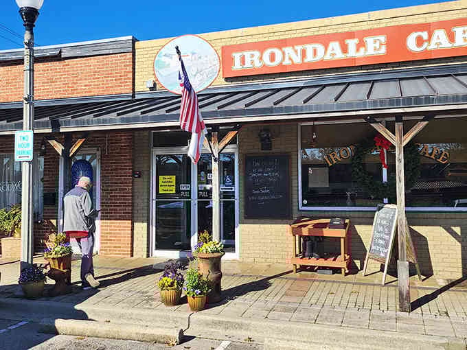 That charming brick facade and welcoming porch tell you everything: real Southern comfort food lives here, friends.