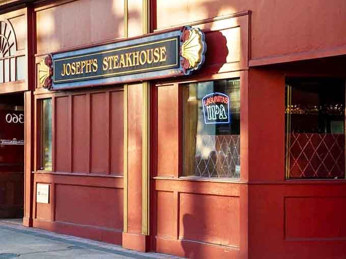 That classic red facade and elegant gold trim practically whisper "perfectly aged ribeye" before you even step inside.