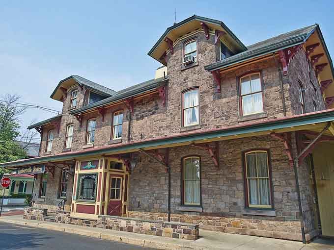 This stone station building stands like a monument to when train travel meant something grand and romantic.