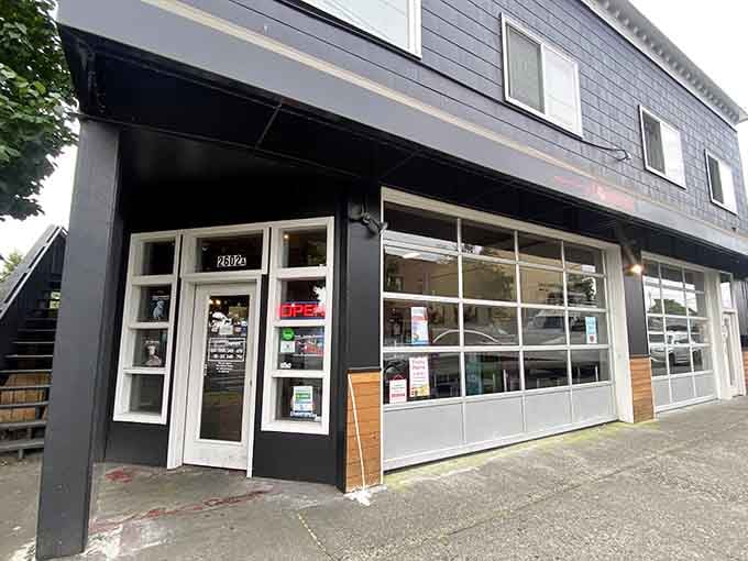 Modern storefront meets timeless tradition where those big windows reveal fresh donuts waiting inside for lucky customers.
