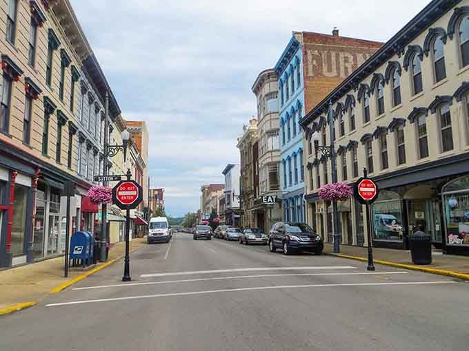 This rainbow of storefronts looks like someone spilled a paint box on Main Street in the best way possible.