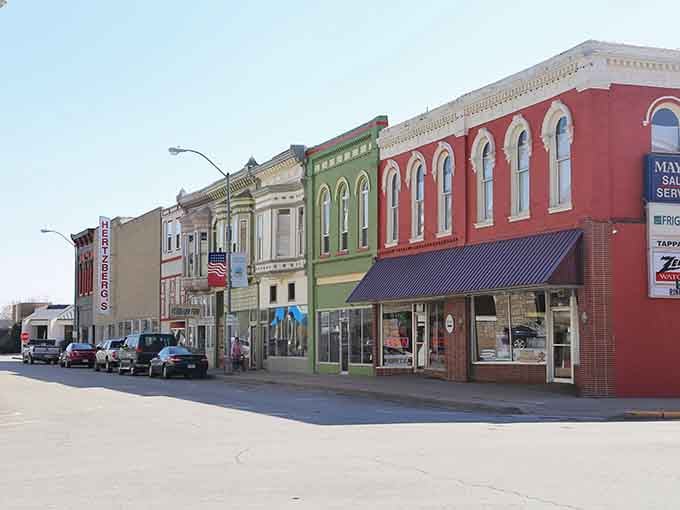 These colorful storefronts line up like a rainbow of small-town charm, each building telling its own story.