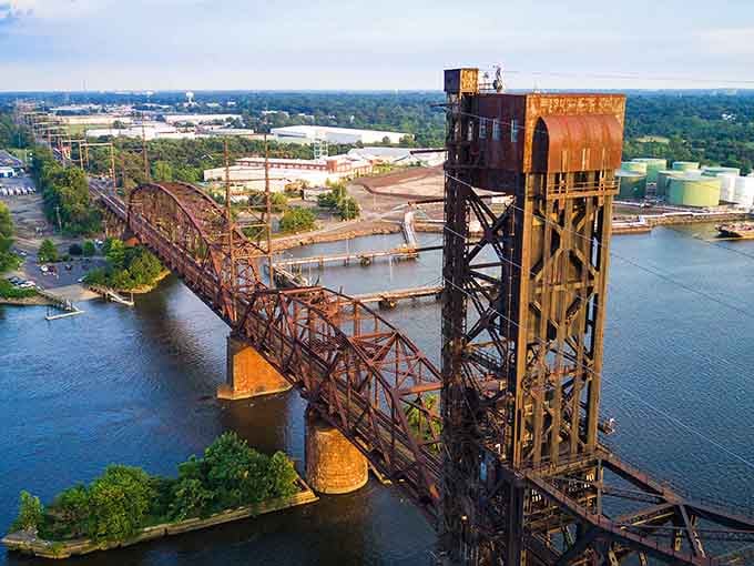 That rusty bridge tower stands like a proud sentinel over the Delaware River, connecting communities and memories.