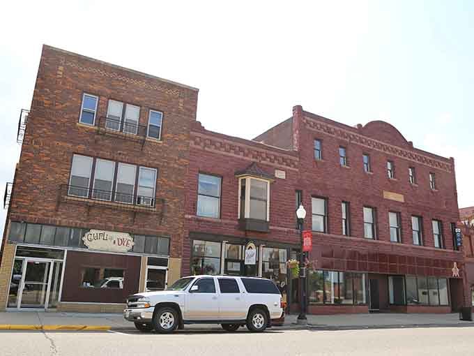 Classic brick storefronts line quiet streets where every building whispers tales from a gentler era.