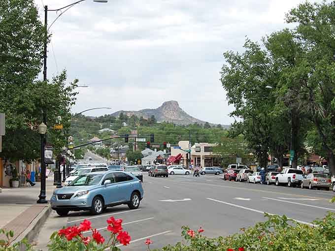 Thumb Butte rises like a natural exclamation point behind downtown, where flowers bloom and history whispers from every corner.