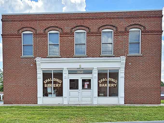 That classic brick facade with white trim looks like it stepped right out of a Norman Rockwell painting.