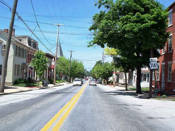 Tree-lined streets and brick buildings create a scene straight from a simpler time in American history.