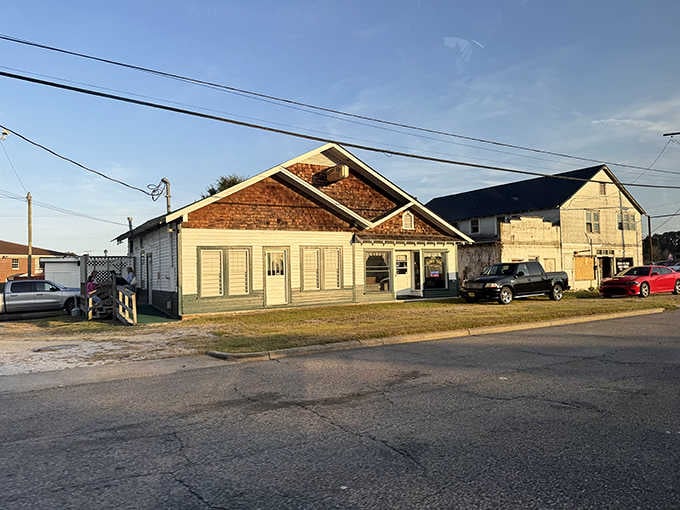 Golden hour light bathes this unassuming building where fresh oysters await inside those humble walls.