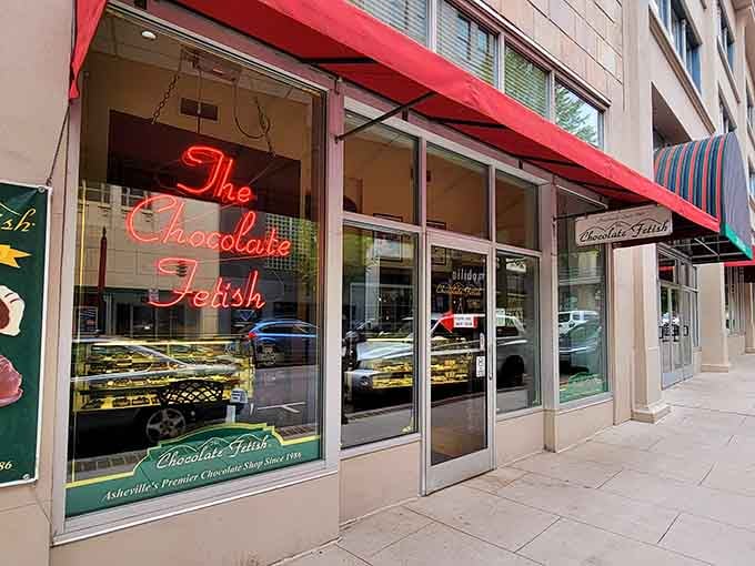 That glowing red neon sign beckons like a chocolate-scented lighthouse guiding sweet-toothed sailors to shore.