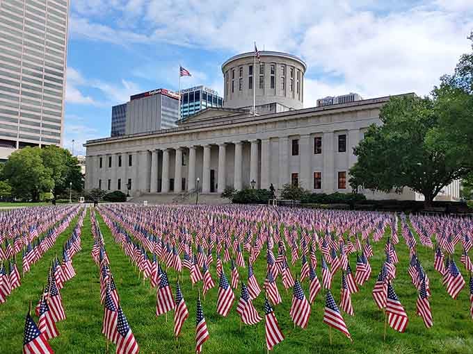 Thousands of flags transform the Statehouse lawn into a powerful tribute that stops you in your tracks.