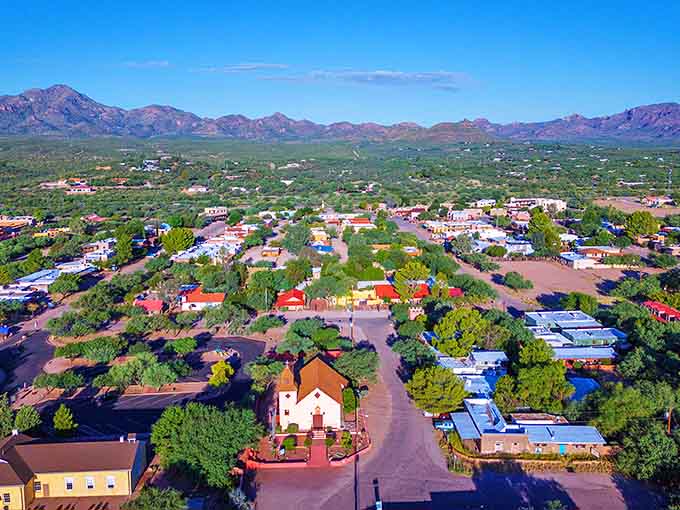 Arizona's oldest European settlement spreads beneath mountain peaks, where art galleries now fill centuries-old adobe walls.
