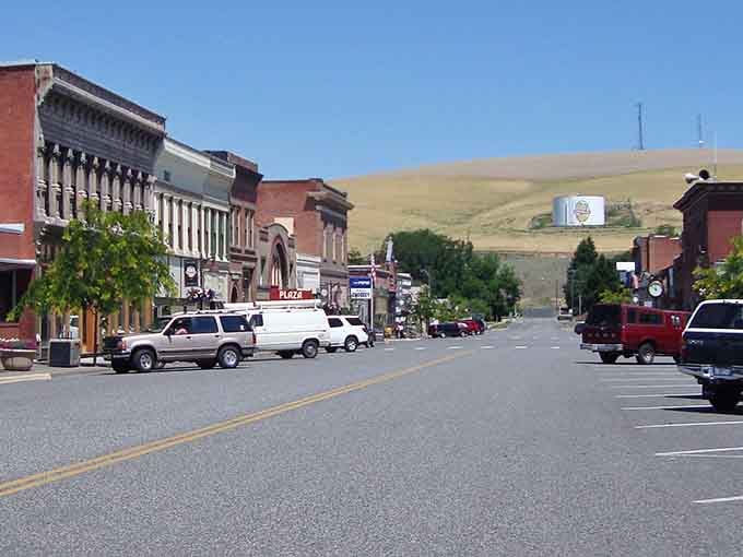 Classic brick storefronts line this peaceful main street where golden hills roll right up to the edge of town.