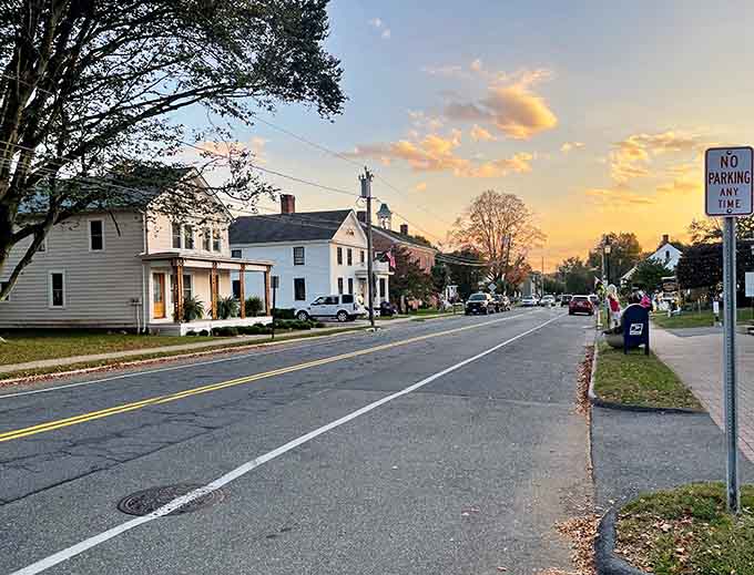 Golden hour transforms this historic street into a Norman Rockwell painting come to life, complete with colonial charm.