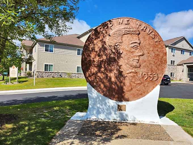 Lincoln's profile gleams in copper glory on this oversized 1953 penny standing proud in a quiet neighborhood.