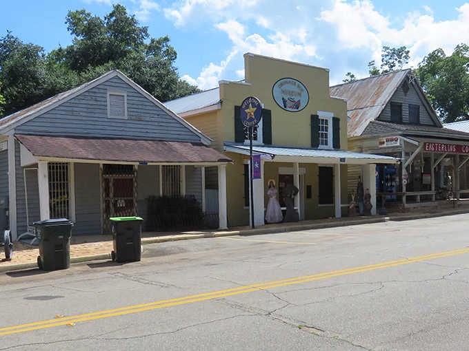 Old storefronts line the quiet street where time moves slower and memories linger in every weathered board.