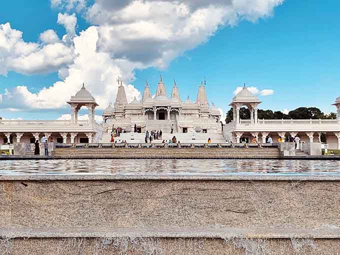 The pristine white stone gleams under Georgia sunshine, proving beauty transcends borders and speaks every language fluently.