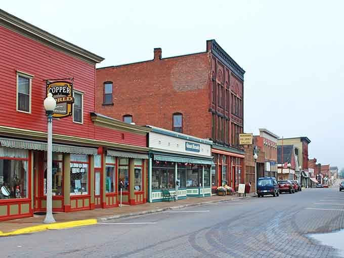 Red brick buildings stand proud along quiet streets where copper fortunes once built an American dream.