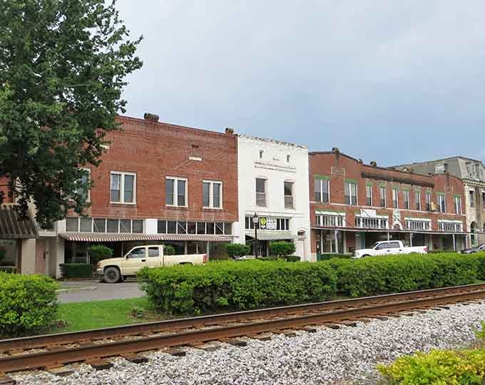 Classic brick storefronts line quiet streets where the railroad still runs, like a Norman Rockwell painting come to life.