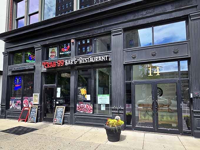 The colorful neon seafood signs in those windows promise a feast that'll have you cracking shells with pure joy.