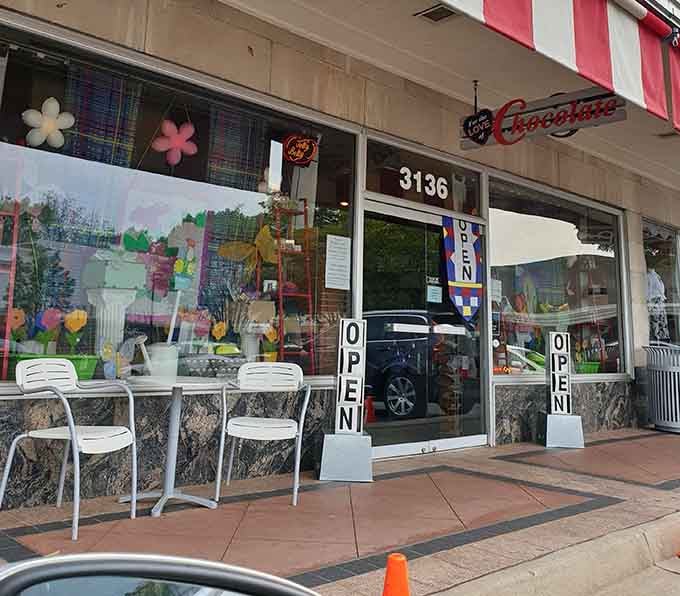 Those cheerful white chairs outside say "sit, relax, enjoy" – the perfect spot for savoring sweet treasures.