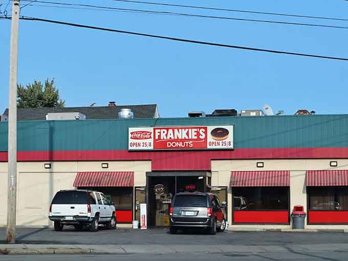 Those striped awnings frame the entrance like a stage curtain revealing fresh-baked morning treasures inside.