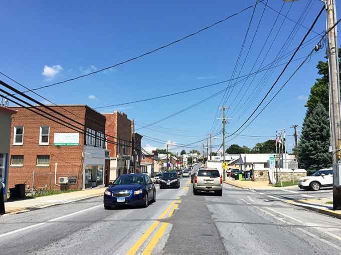 Brick storefronts and blue skies create that timeless Main Street America vibe we all remember fondly.