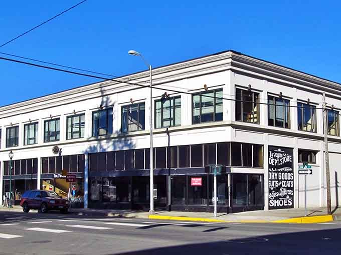 That corner building stands proud under blue skies, a testament to small-town architecture that still works.