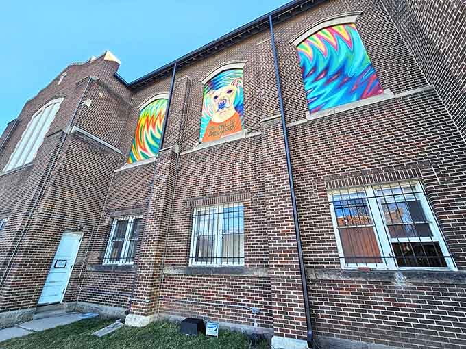 The vibrant murals on this brick exterior hint at the kaleidoscope of colors waiting inside this transformed space.