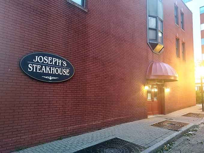 When the evening lights glow warm against brick, you know something delicious is waiting behind those doors.