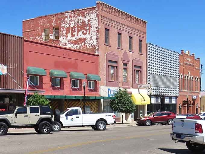 Those faded ghost signs on brick buildings tell stories of commerce and community stretching back through generations of Colorado history.