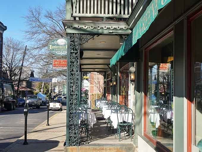 Those ornate iron columns and outdoor cafe tables create the perfect spot for watching the world slow down.