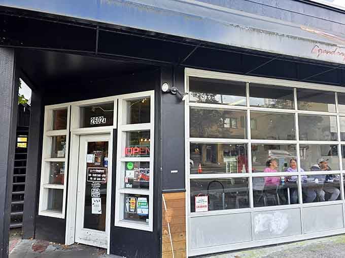 That glowing "OPEN" sign is like a beacon calling you toward glazed happiness and sweet morning possibilities.