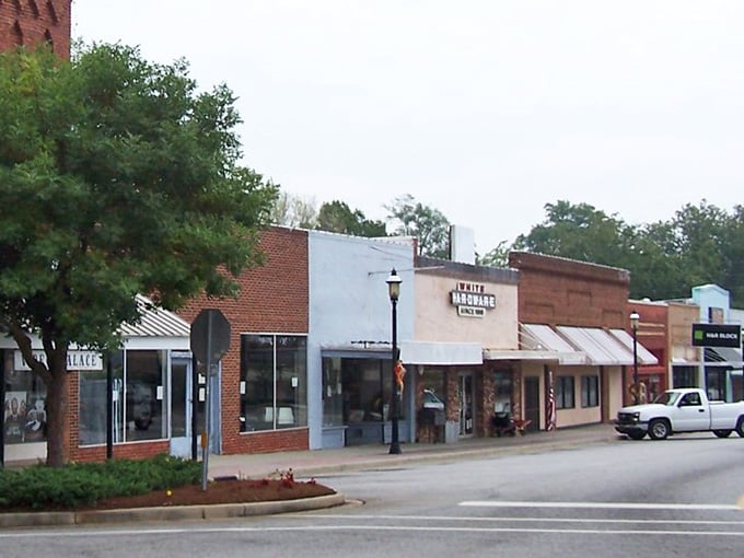 Classic brick storefronts line this peaceful street where time moves slower and neighbors still know each other's names.