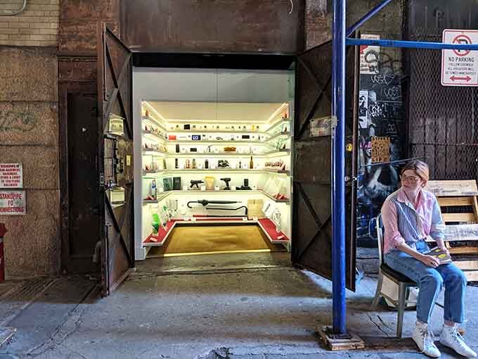 A visitor contemplates curiosities in this closet-sized wonder, proving great things really do come in small packages.