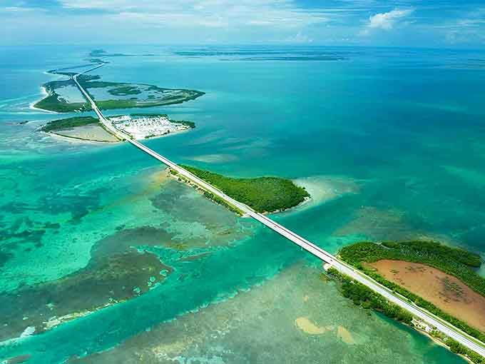 Island-hopping by car becomes reality here, where bridges connect tropical keys across impossibly turquoise water that seems almost unreal.