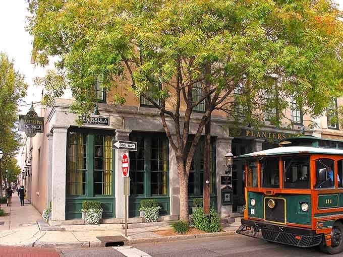 Charleston's charm meets fine dining on this historic corner where trolleys roll past and Peninsula Grill beckons hungry travelers.