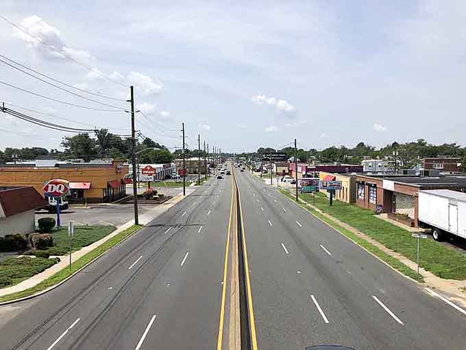 Wide open roads and familiar storefronts create that classic American town vibe we all remember fondly.