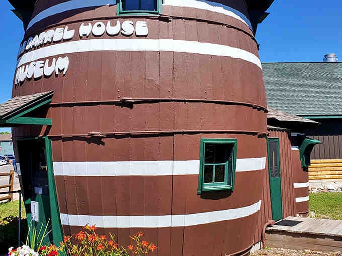 The museum signage confirms it: yes, you really can live inside a giant pickle barrel in Michigan.