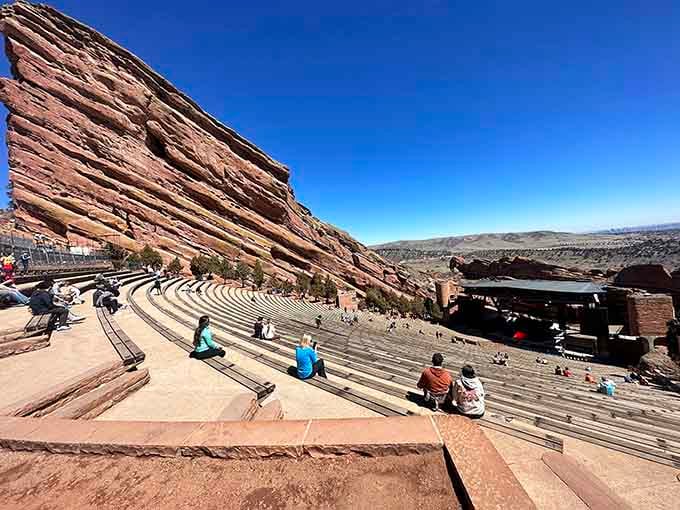 The amphitheater sits empty under blue skies, waiting for the next show while offering free views that rival any performance.