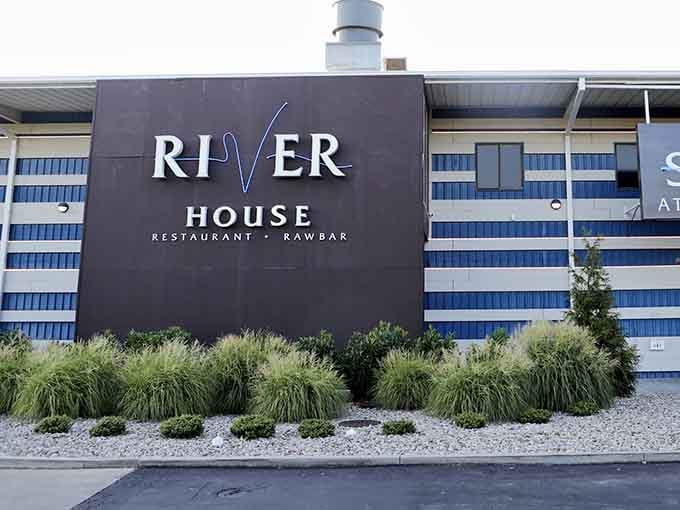 The landscaping is lovely, but that "raw bar" promise on the sign is what really catches your eye.