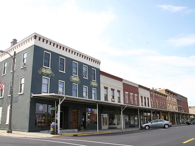 Charming downtown architecture meets small-town tranquility where even small murals brighten century-old buildings beautifully.