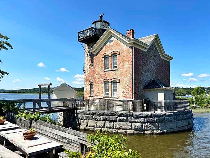 That black lantern room crowning this riverside lighthouse has been guiding boats and stealing hearts for generations along the peaceful shore.