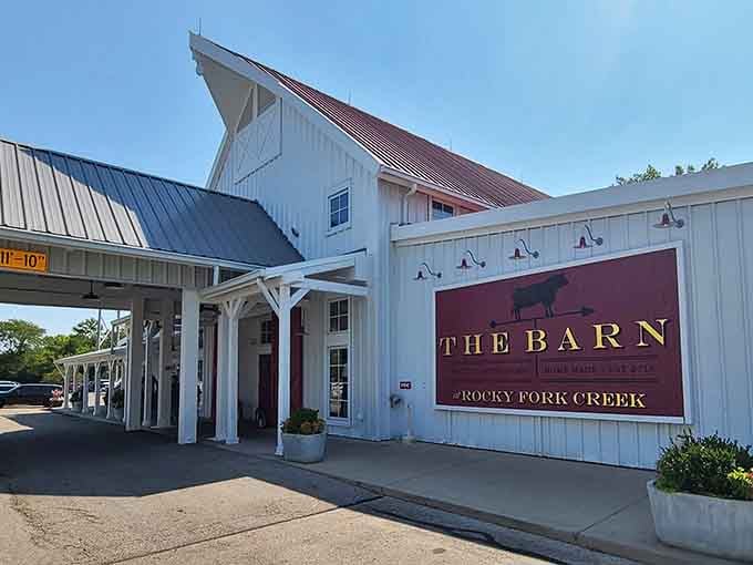 Blue skies and white columns frame this converted barn where rustic meets refined in the best way.