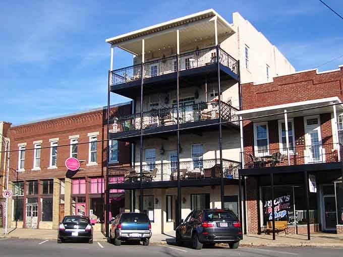 Multi-story balconies offer front-row seats to the kind of small-town life that never goes out of style.
