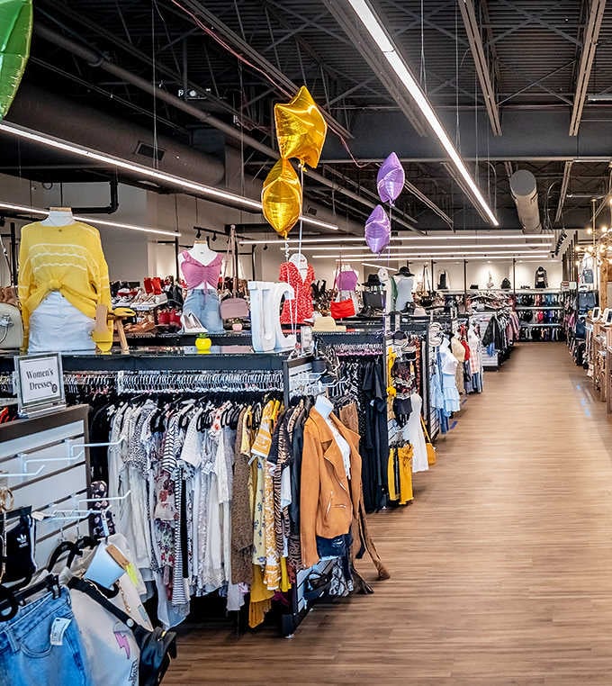 Racks stretch endlessly like a rainbow of second chances, making shopping feel less like hunting and more like browsing.
