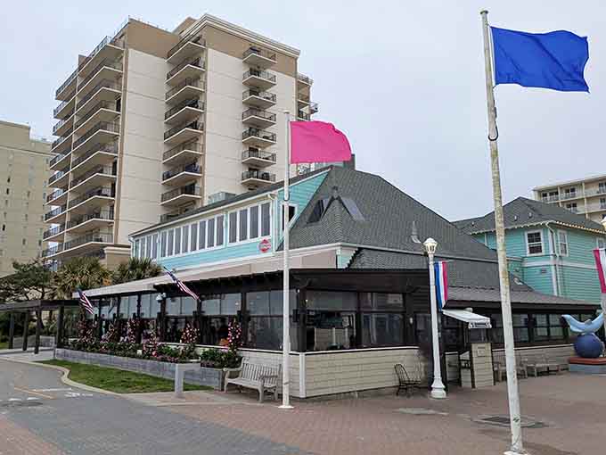 Those colorful flags dancing in the breeze signal good times ahead at this beachside gem with serious coastal charm.